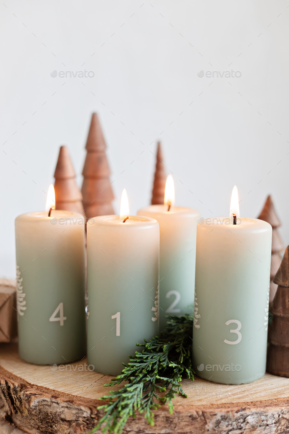 Handmade modern advent wreath with four candles Stock Photo by OksaLy