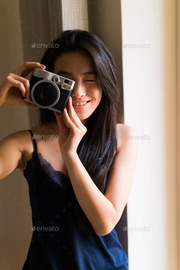 Chinese girl with a camera at home Stock Photo by kikea3 | PhotoDune