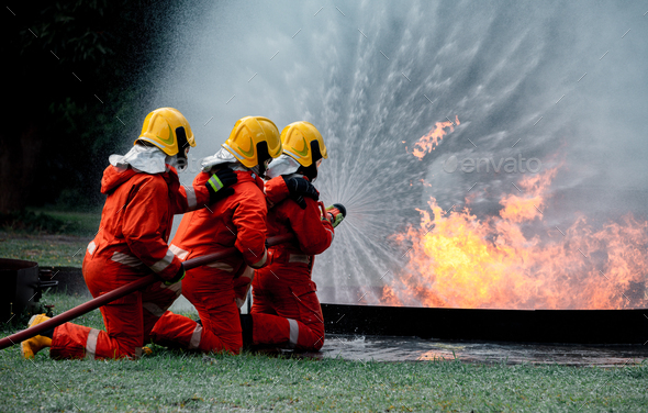 Firefighters safety using twirl water fog type fire extinguisher to ...