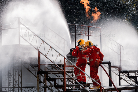 Firefighters safety using twirl water fog type fire extinguisher to ...