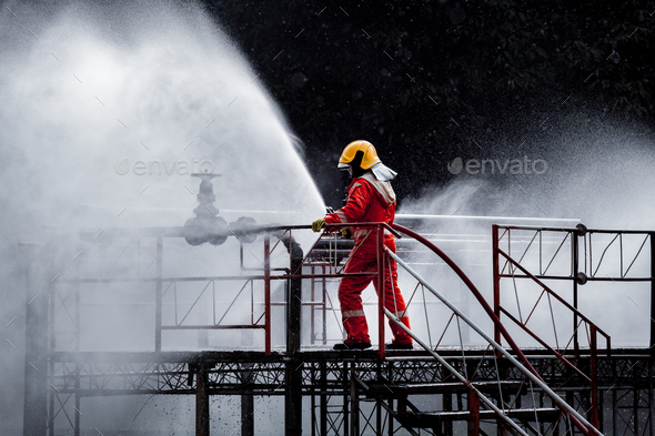 Firefighters safety using twirl water fog type fire extinguisher to ...