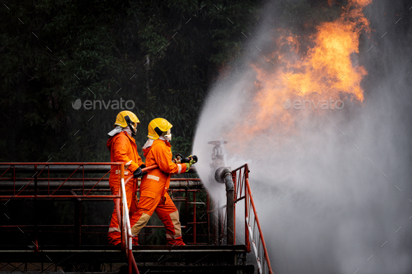 Firefighters safety using twirl water fog type fire extinguisher to ...