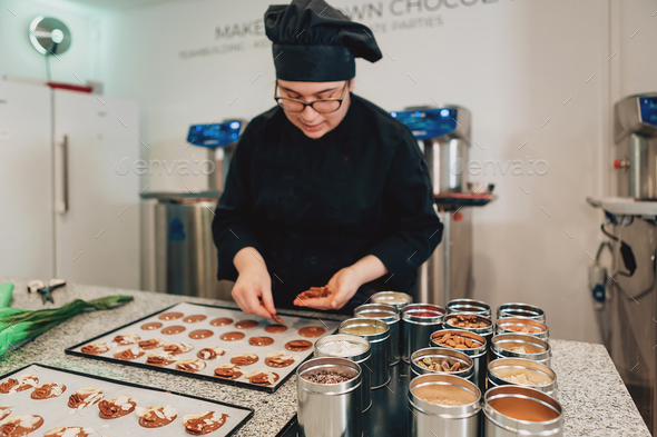 real female master chef chocolatier working in artisanal professional ...