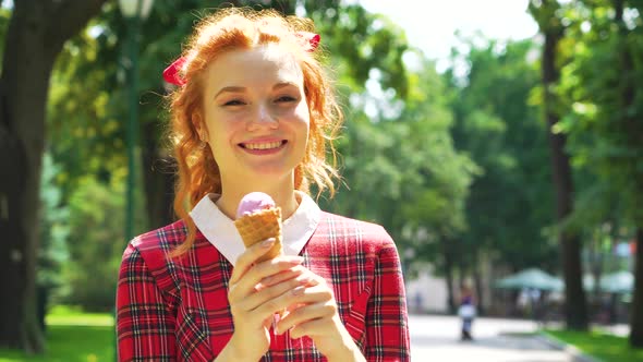 Smiling Red Haired Girl Walking with Ice Cream in Park on Sunny Day ...