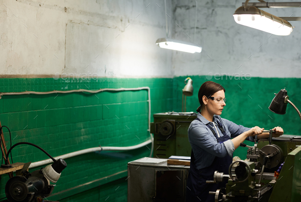 Performing turning operation on lathe Stock Photo by Media_photos ...