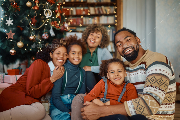Portrait of happy black multi-generation family celebrating Christmas ...