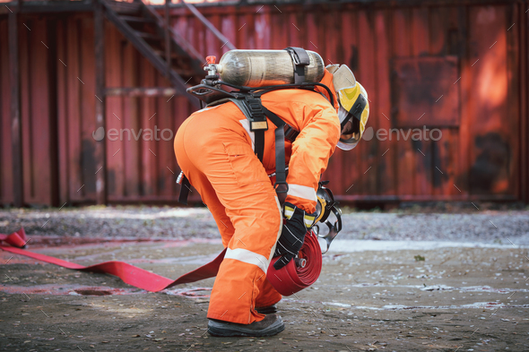 Firefighters safety using twirl water fog type fire extinguisher to ...