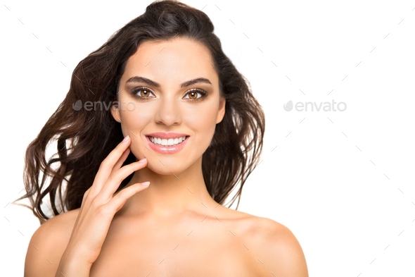 Portrait of a beautiful brunette with open smile on white background ...