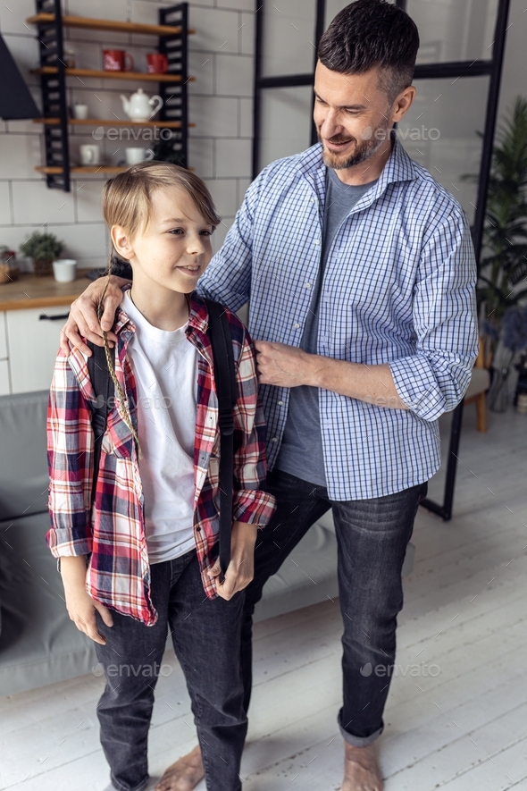 Handsome young strong father and his teenage son - back to school ...