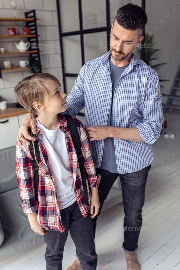 Handsome young strong father and his teenage son - back to school ...