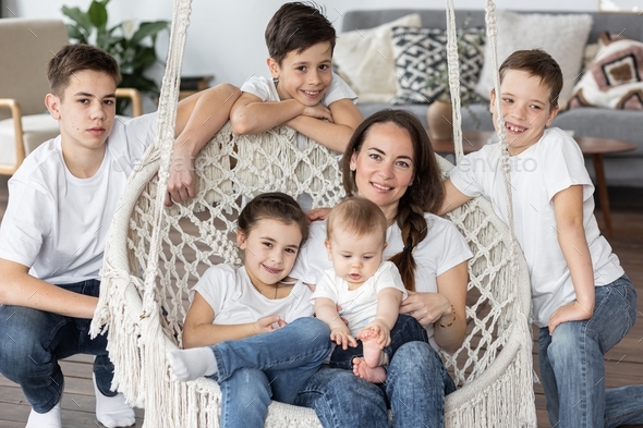 Family portrait. Young beautiful mother and her five children, four ...