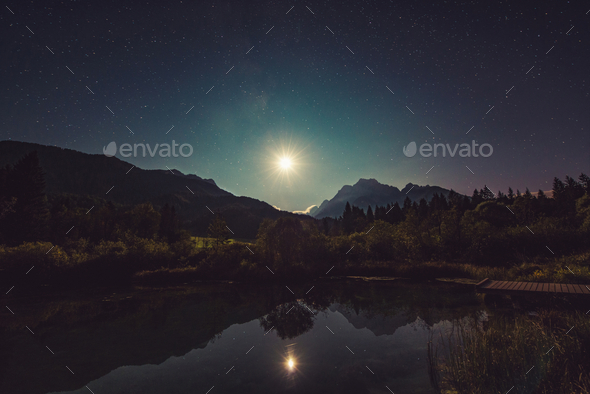 Starry night and moonlight at the spring of river Sava, called Zelenci ...