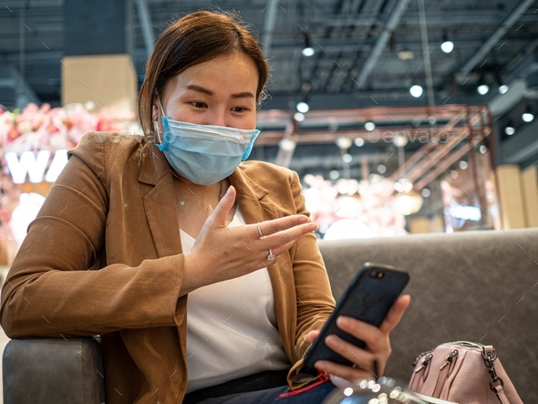 businesswomen ceo manager company office wear mask and brown suit is ...