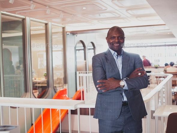 Businessman male smart handsome south africa look at camera arm cross ...