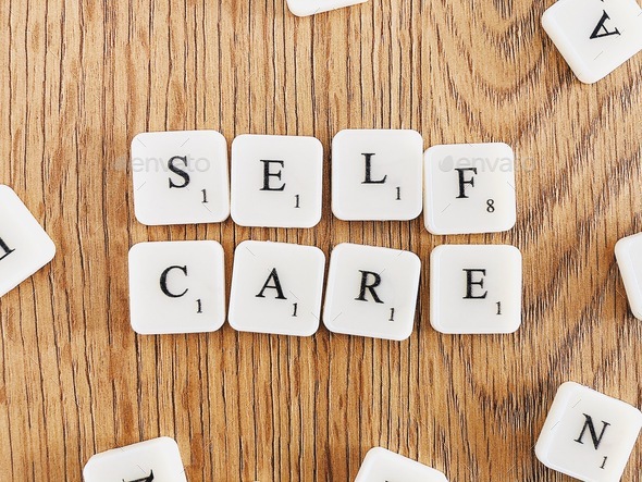“Self care” written with scrabble tiles Stock Photo by alexandrazaza