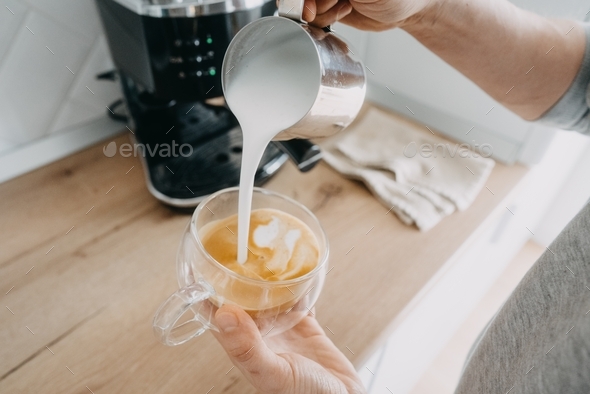 Pouring milk foam in coffee cup Stock Photo by silvia_i21 | PhotoDune