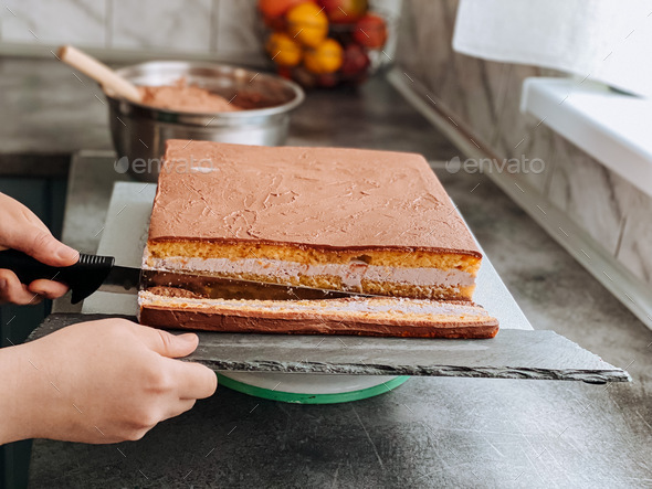 Cutting a chocolate cake Stock Photo by silvia_i21 | PhotoDune