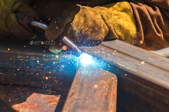 Welding work, welder welding metal material in heavy industry ...