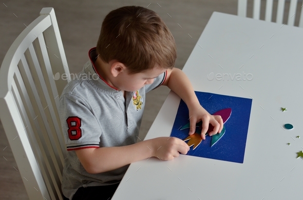 boy making paper craft Stock Photo by nata_llo | PhotoDune