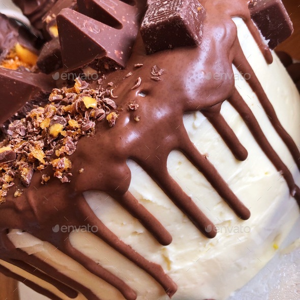 Chocolate drip birthday celebration cake Stock Photo by betterxtogether