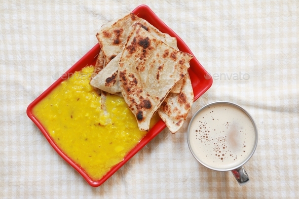 Roti Paratha with Dhal curry and a cup of milk coffee Stock Photo by ...