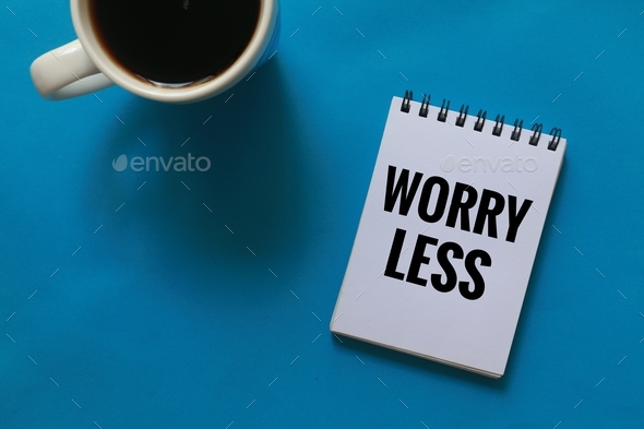 Inspirational and Motivational quotes-'Worry Less' written on a notepad ...