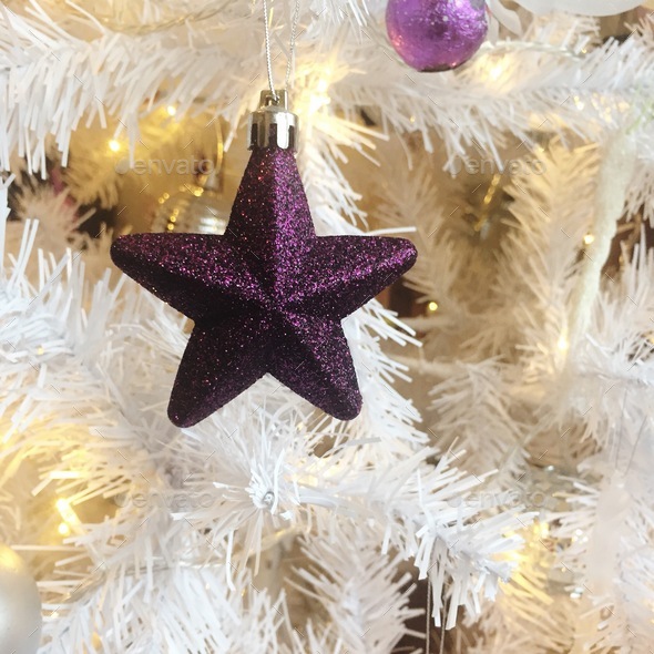 Purple sparkly star hanging Christmas decorations on a white tree Stock ...