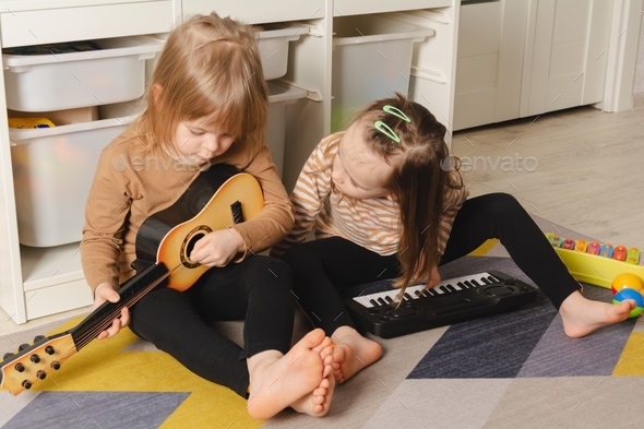 Happy children playing musical instruments at home Stock Photo by ...