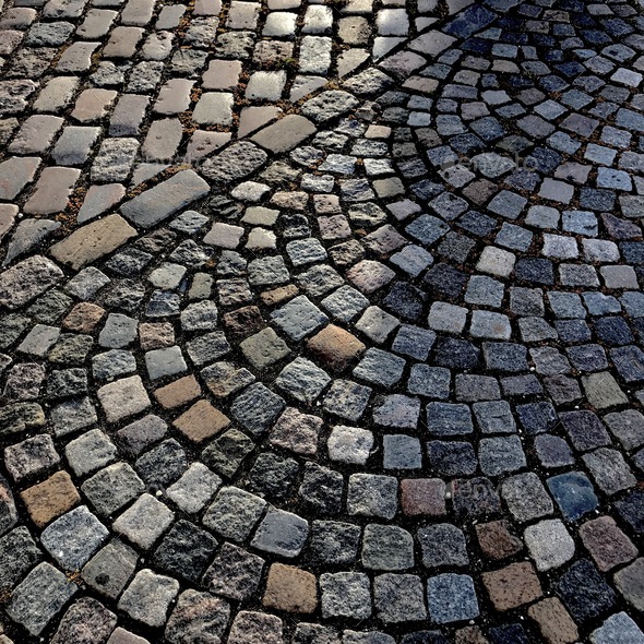Cobblestoned pavement with curved and straight lines Stock Photo by ...