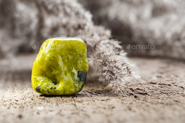 Yellow Lizardite Mineral Rock Specimen on Wood Stock Photo by Portoprens