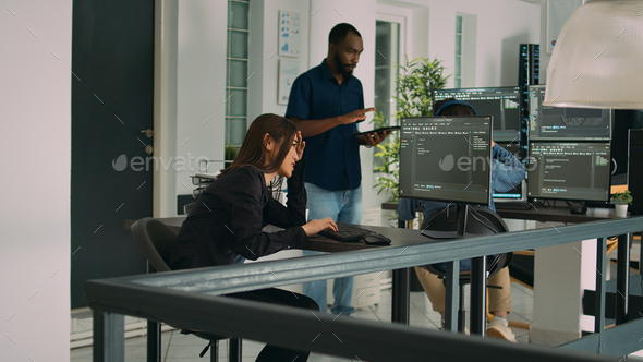 Software programer feeling stressed about writing code in front of computer Stock Photo by DC_Studio