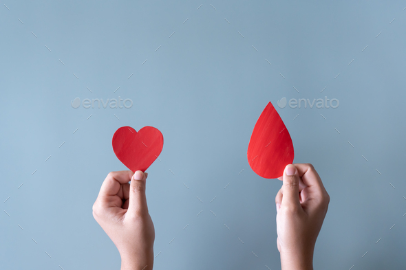 Blood donation or surgery concept. Human holding blood sign and a red ...