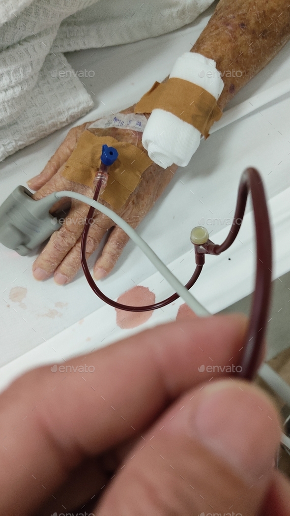 Patient getting blood transfusion in hospital clinic Stock Photo by ...