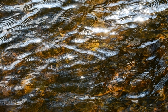 Water background and texture. Clean clear water in the lake. Glittering ...