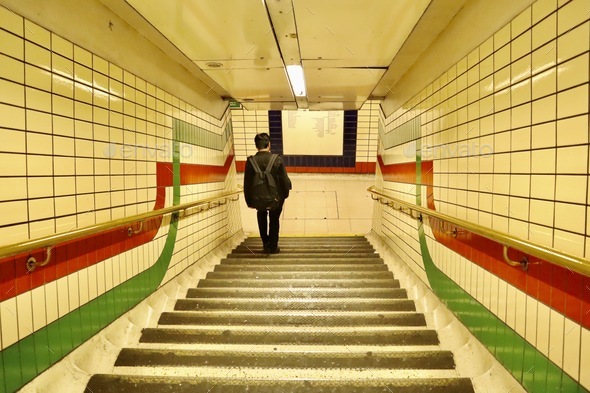 Man walking downstairs Stock Photo by darrenb29 | PhotoDune