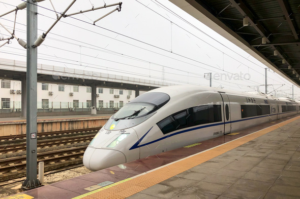 The high speed train at the platform in a railway station in China ...