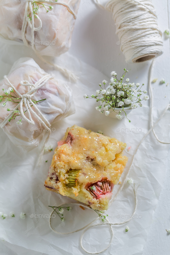 Sweet and tasty yogurt pie packed in a white paper. Stock Photo by Shaiith