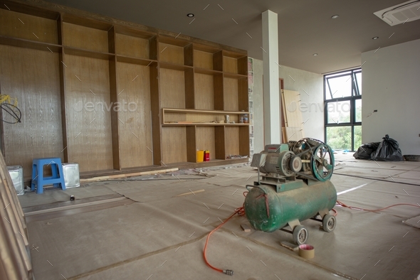 Interior perspective of room under installation with wooden board for ...