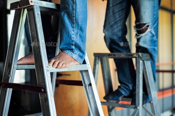 Feet of the workers stand on the ladder Stock Photo by phichatp | PhotoDune
