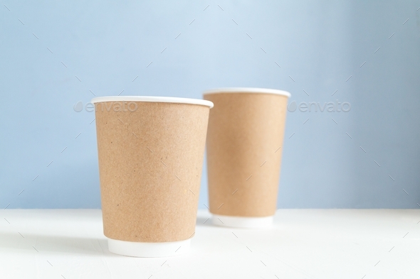 Paper cup against blue background Stock Photo by mamalion2 | PhotoDune