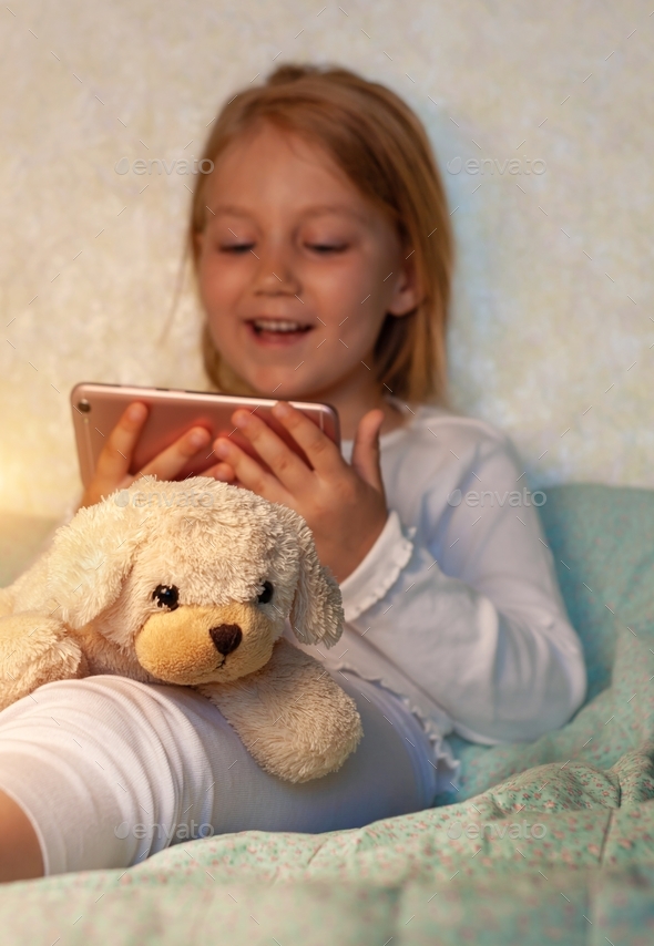 Child studying distance learning.Curious cute preschool girl using ...