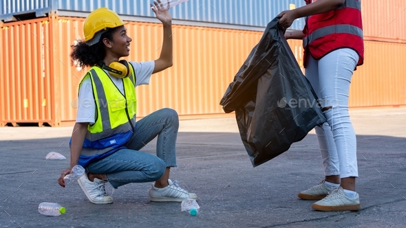 African american woman worker put on safety helmets hand hold garbage ...
