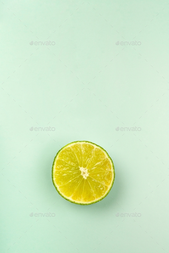 Round slice of lime on plain background Stock Photo by my4m | PhotoDune