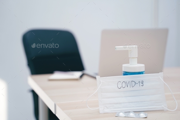 Workspace desk of computer laptop with alcohol sanitizer gel and mask ...