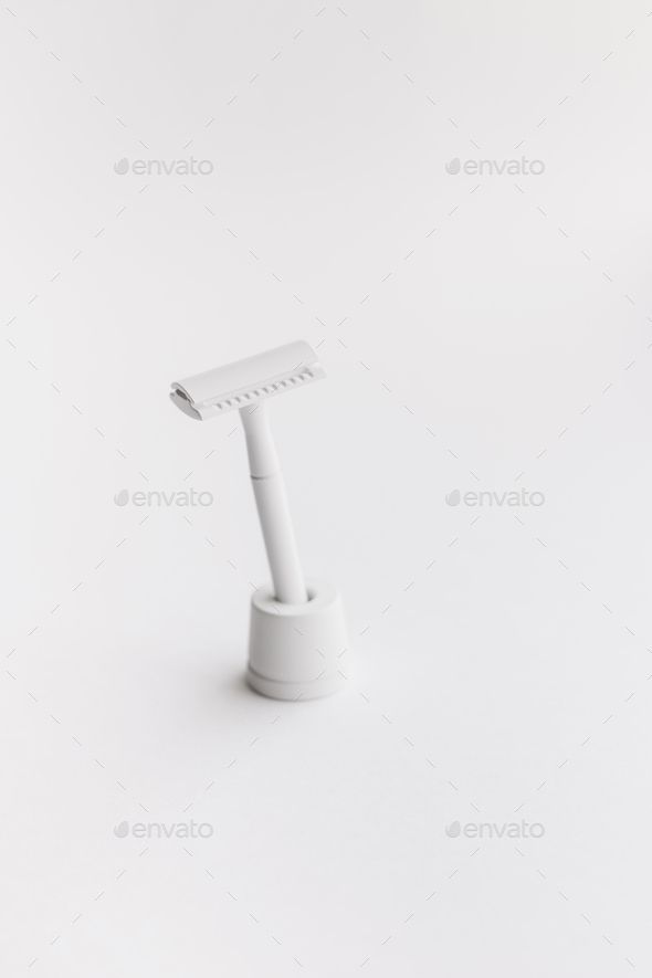 T - shaped metal razor with interchangeable blades. Minimalism. Zero ...