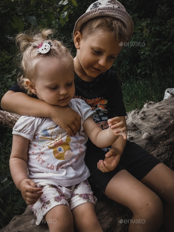 a little boy hugs a little girl Stock Photo by Lo_silance | PhotoDune