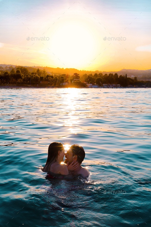 couple kiss in the water Stock Photo by ivananicole95 | PhotoDune
