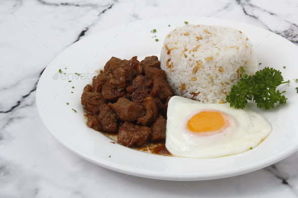 Freshly cooked Pork Adobo with rice and egg Stock Photo by junpinzon
