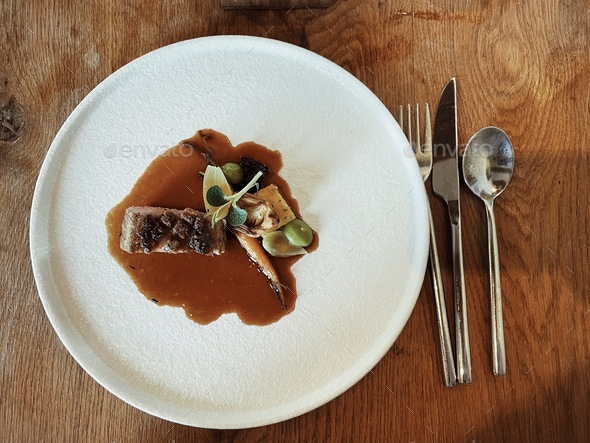 Elegant lamb chop with roasted vegetables and potato purée Stock Photo ...