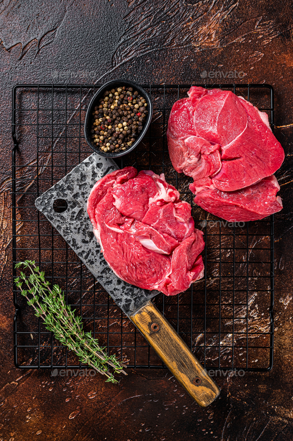 Raw Lamb fillet steaks with herbs and spices, uncooked mutton meat ...